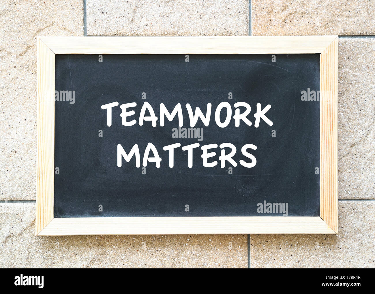 Teamwork matters, words on blackboard. Business or work place core ...