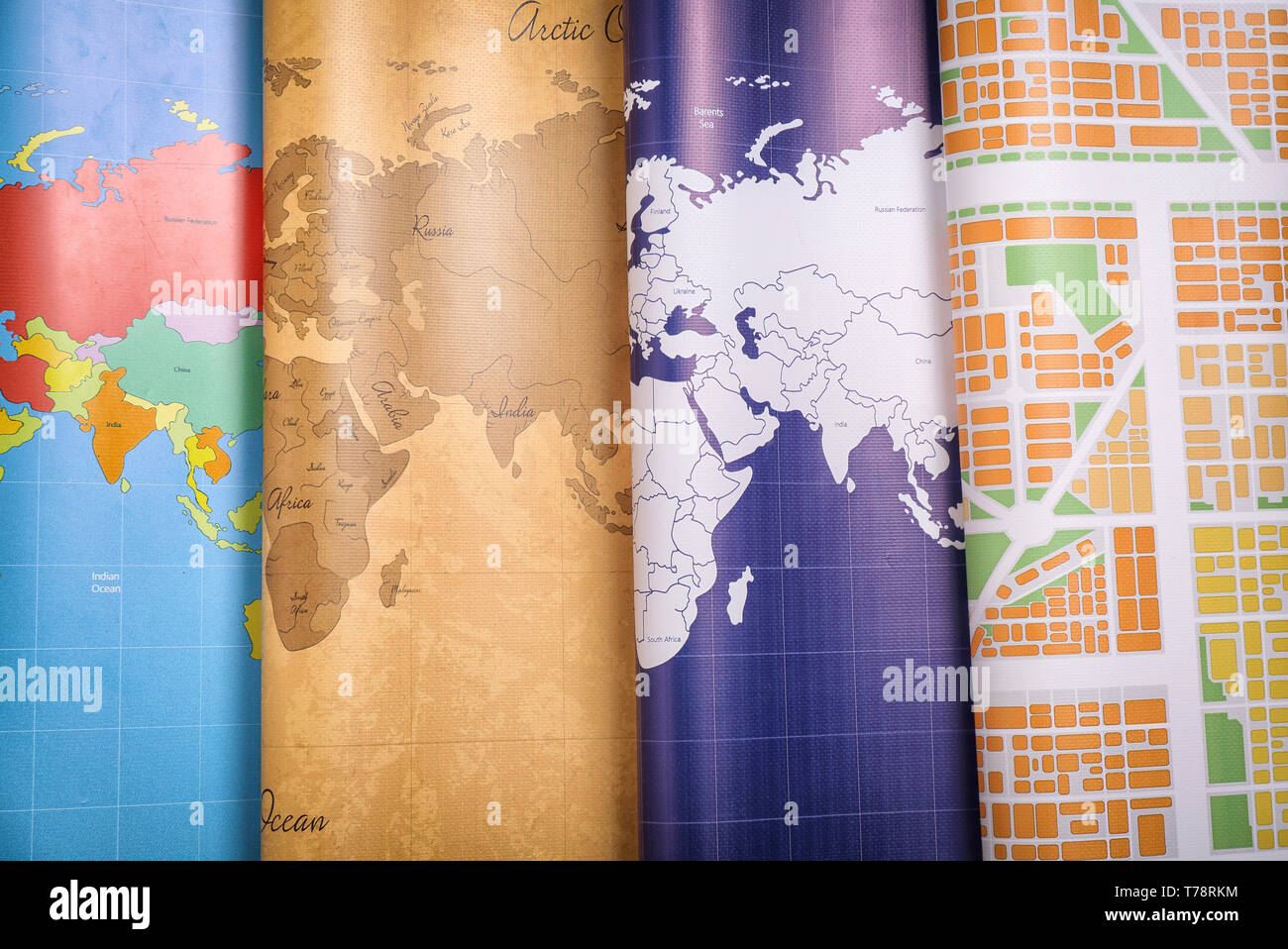 Different world maps, closeup. Travel concept Stock Photo - Alamy