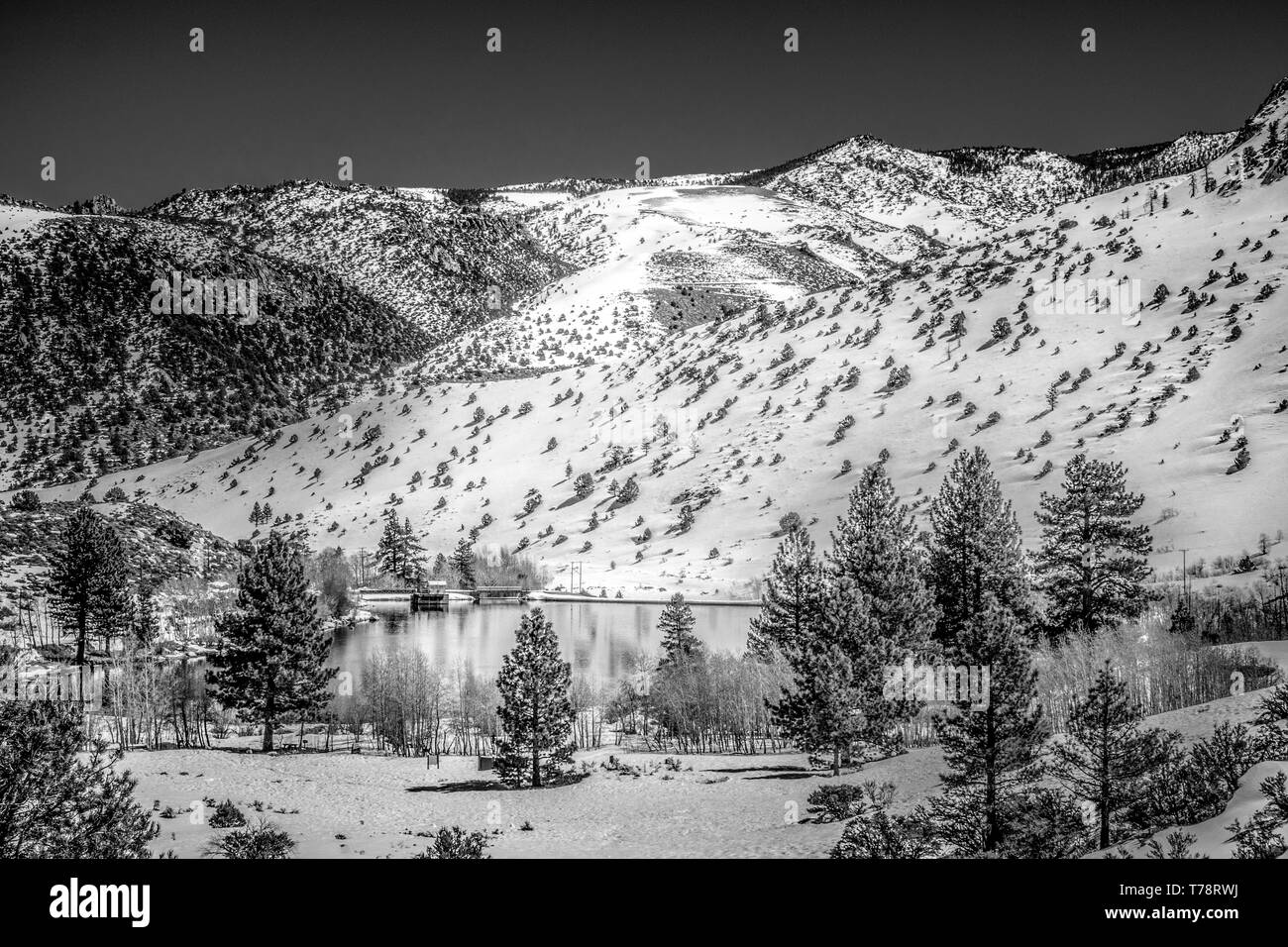 Beautiful pond in the snow covered mountains in the Sierra Nevad Stock ...