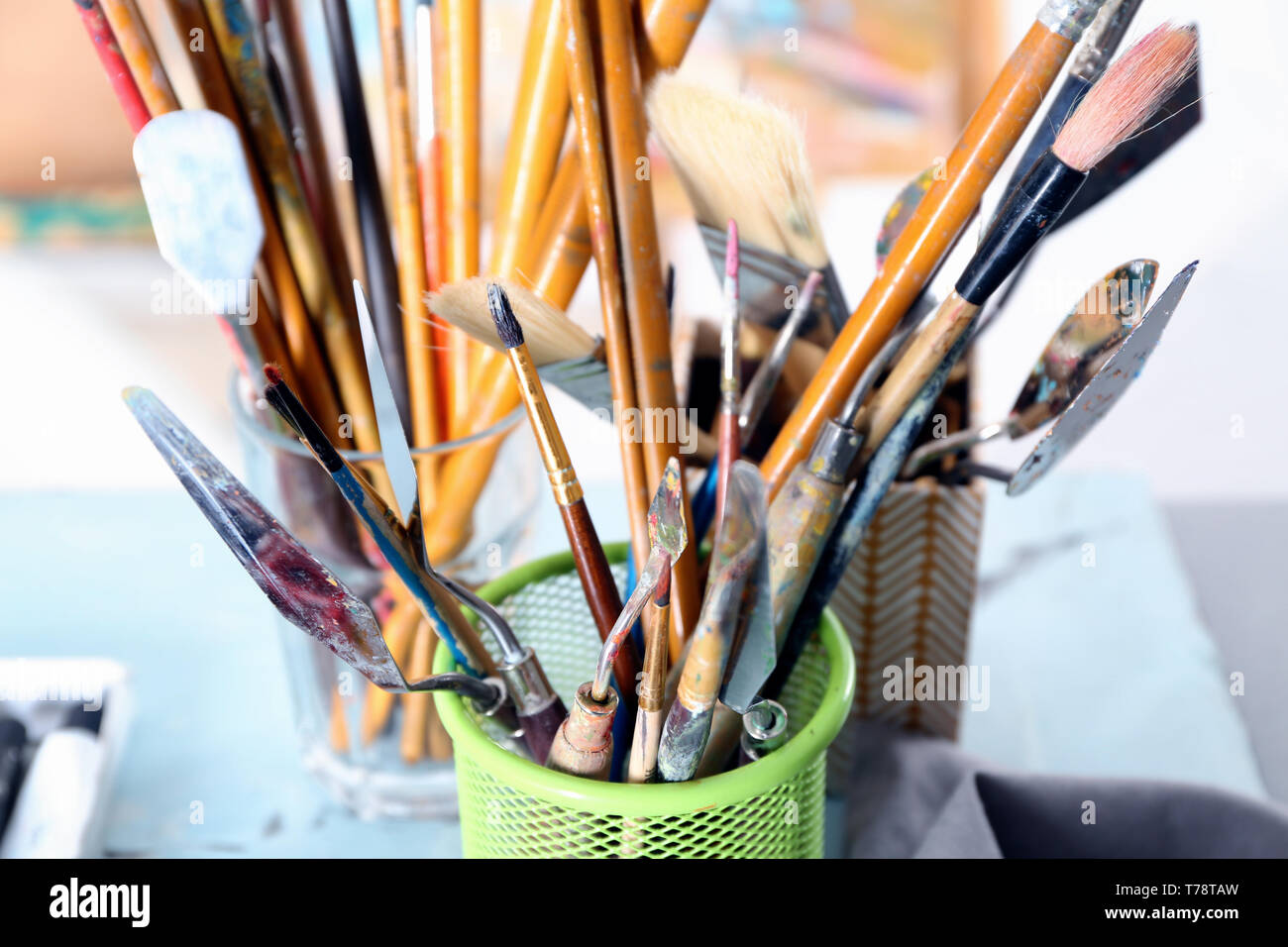 Set of different painter's tools on table Stock Photo - Alamy