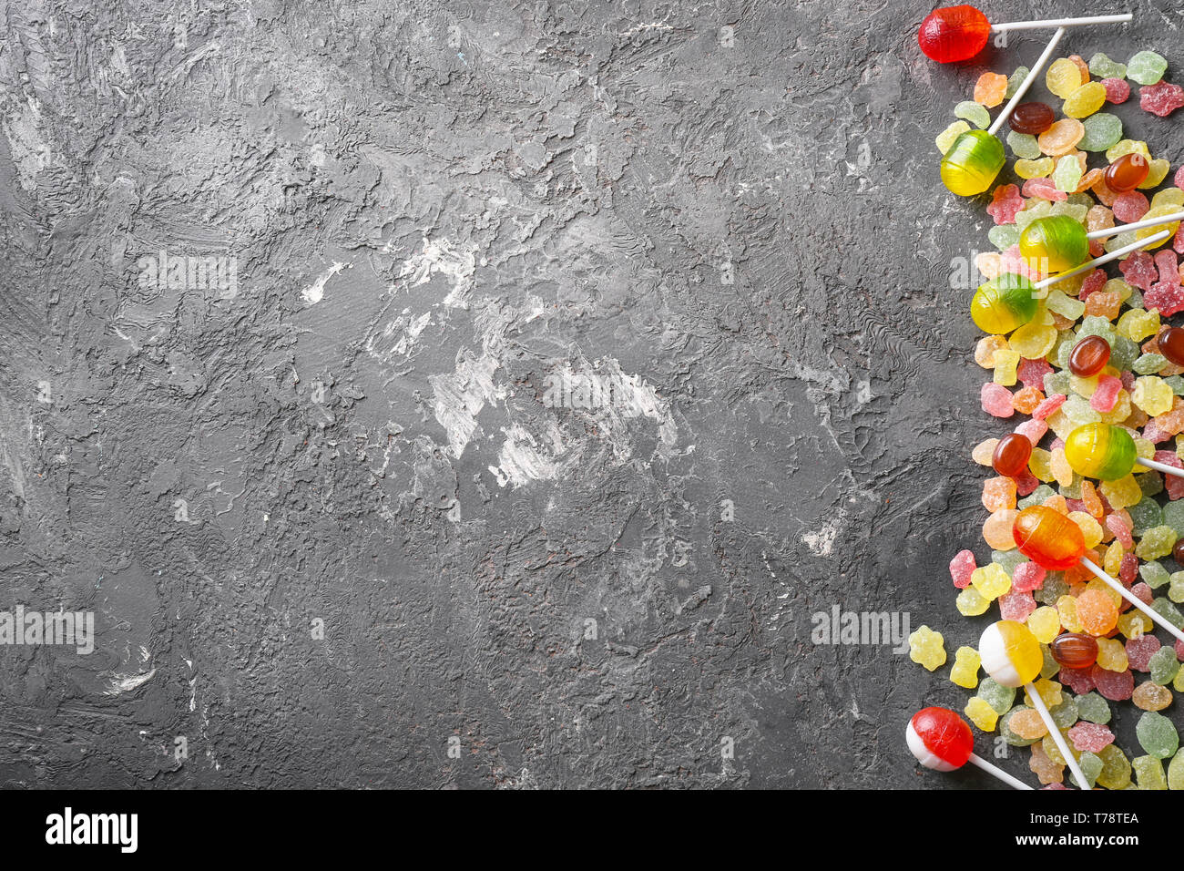 Colorful candies on grey background Stock Photo - Alamy