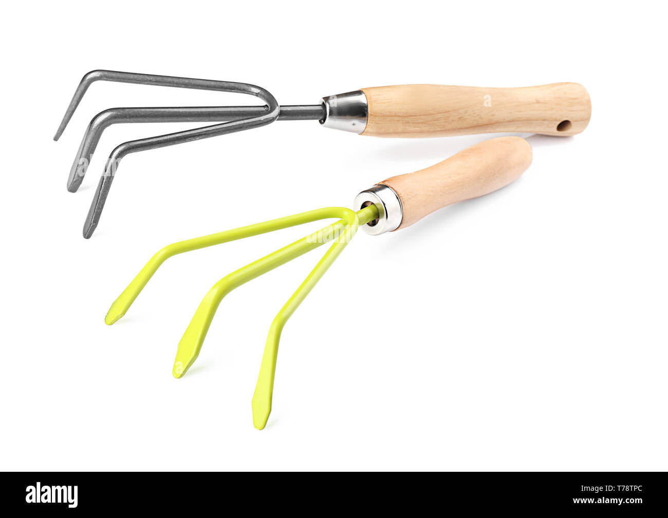 Gardening rakes on white background Stock Photo - Alamy