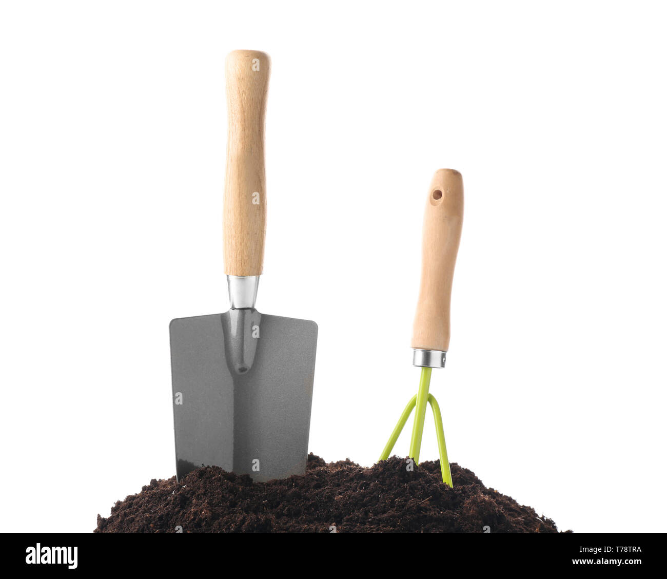 Gardening tools with soil on white background Stock Photo - Alamy