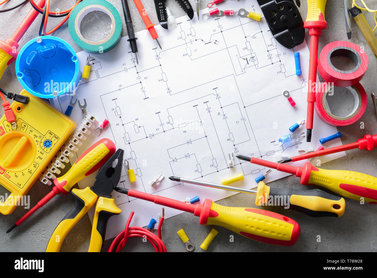 Electrician's supplies and house plan on grey background Stock Photo ...