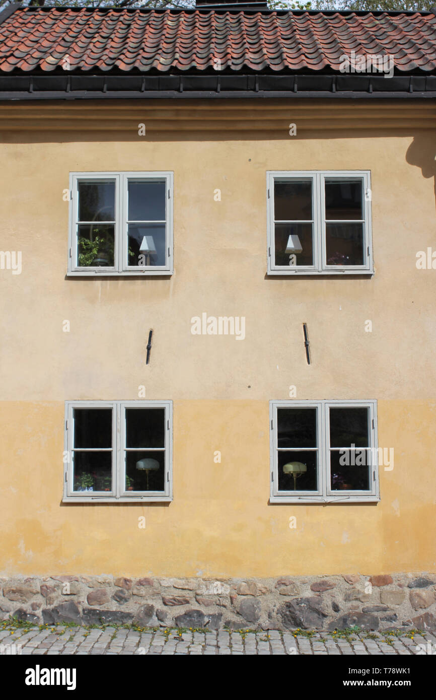 Symmetrical windows and items in the windows Stock Photo - Alamy