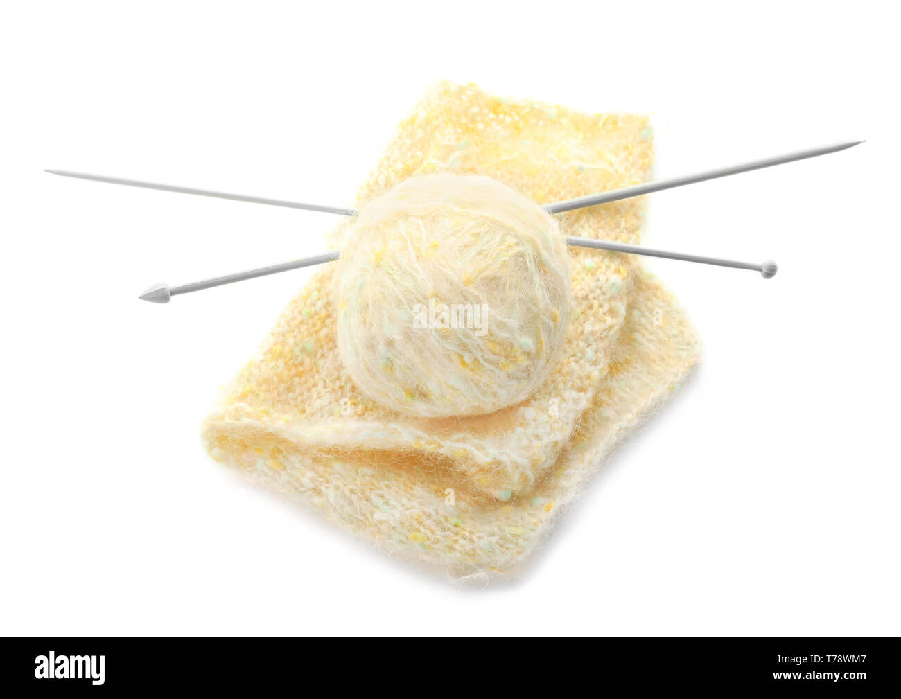 Knitting thread with unfinished clothes on white background Stock Photo ...