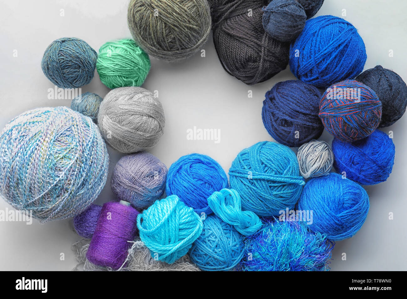 Composition with knitting yarn on white background Stock Photo - Alamy