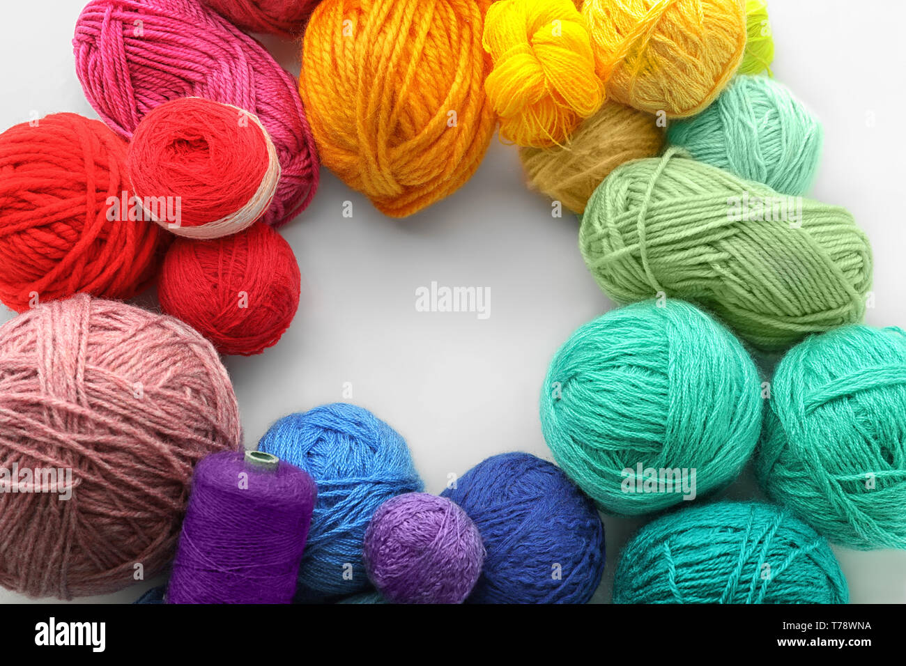 Composition with knitting yarn on white background Stock Photo - Alamy