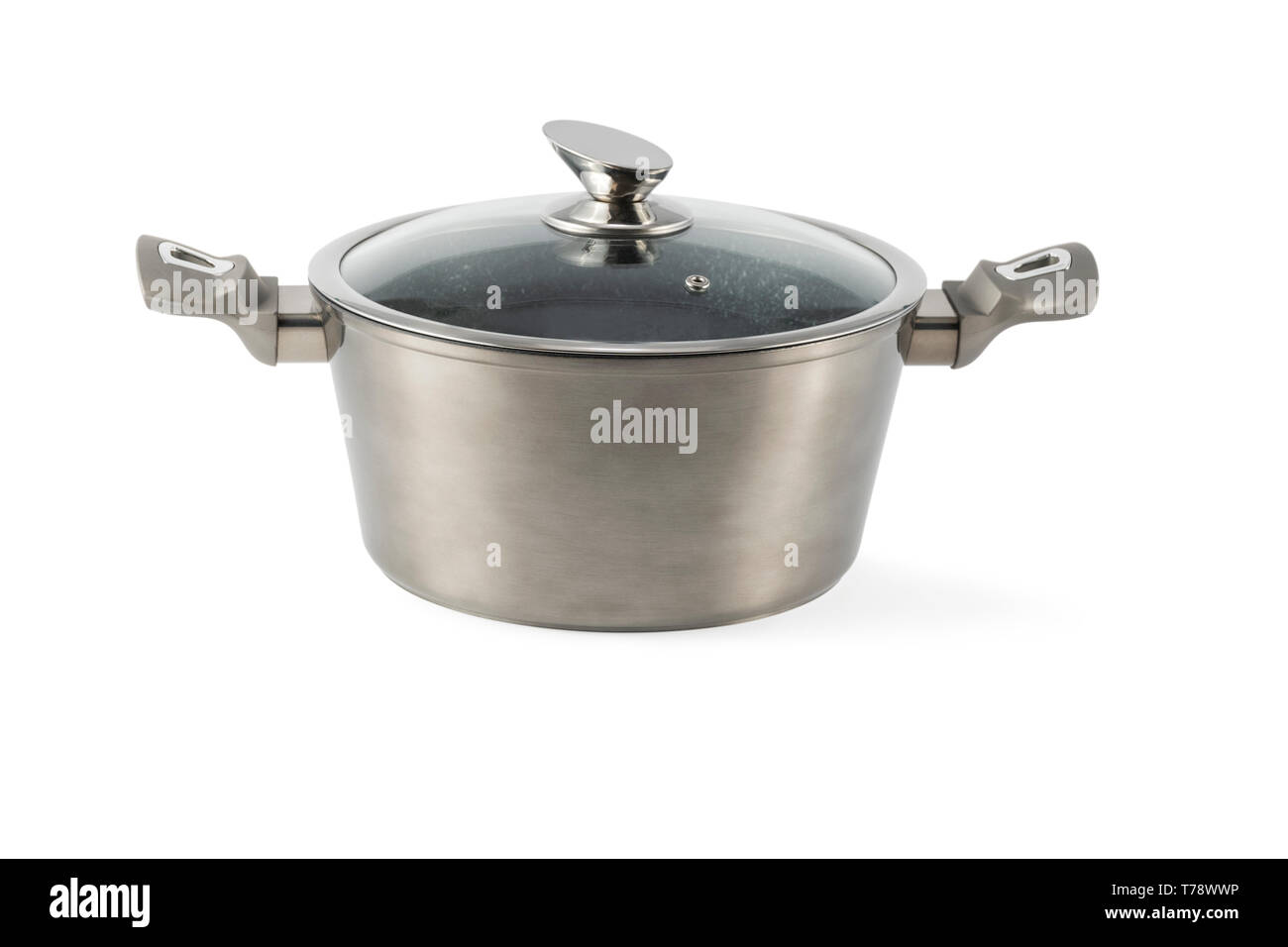 Metal soup pot with two handles and glass lid isolated on white ...