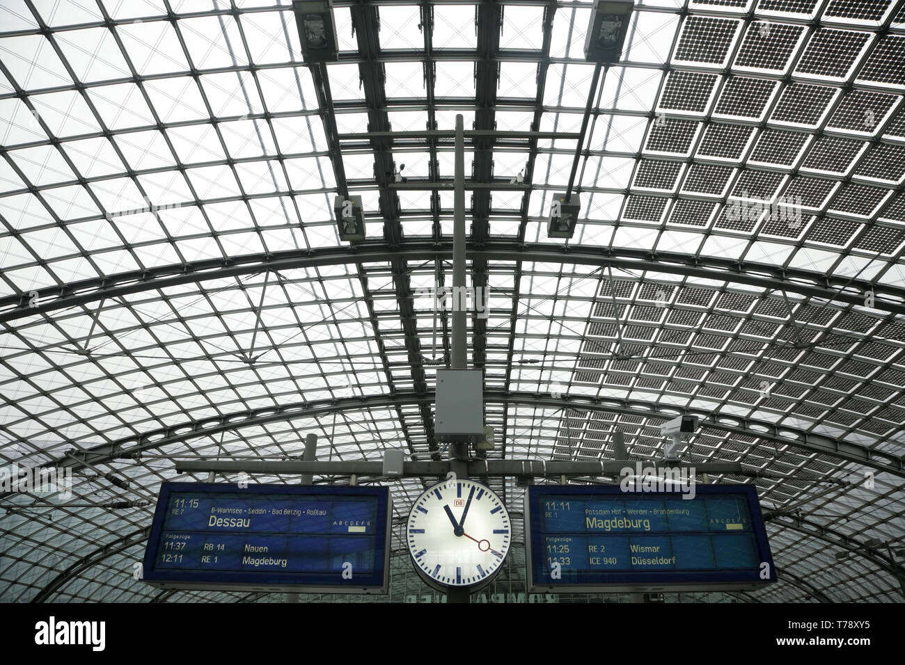 Train information boards and clock at the Hauptbahnhof, Berlin, Germany ...