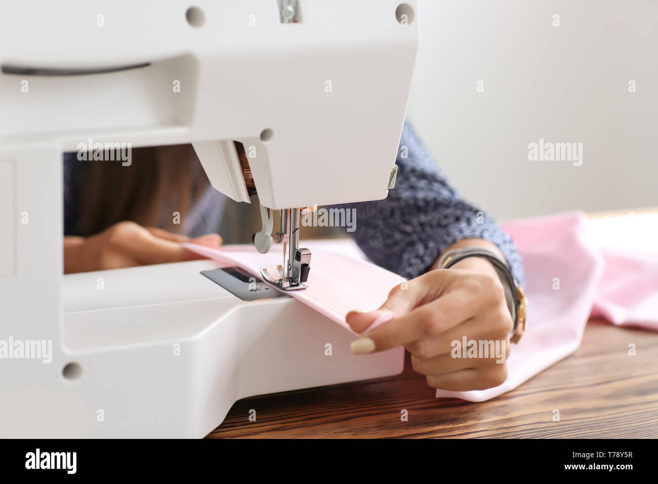 Young female tailor using hi-res stock photography and images - Alamy
