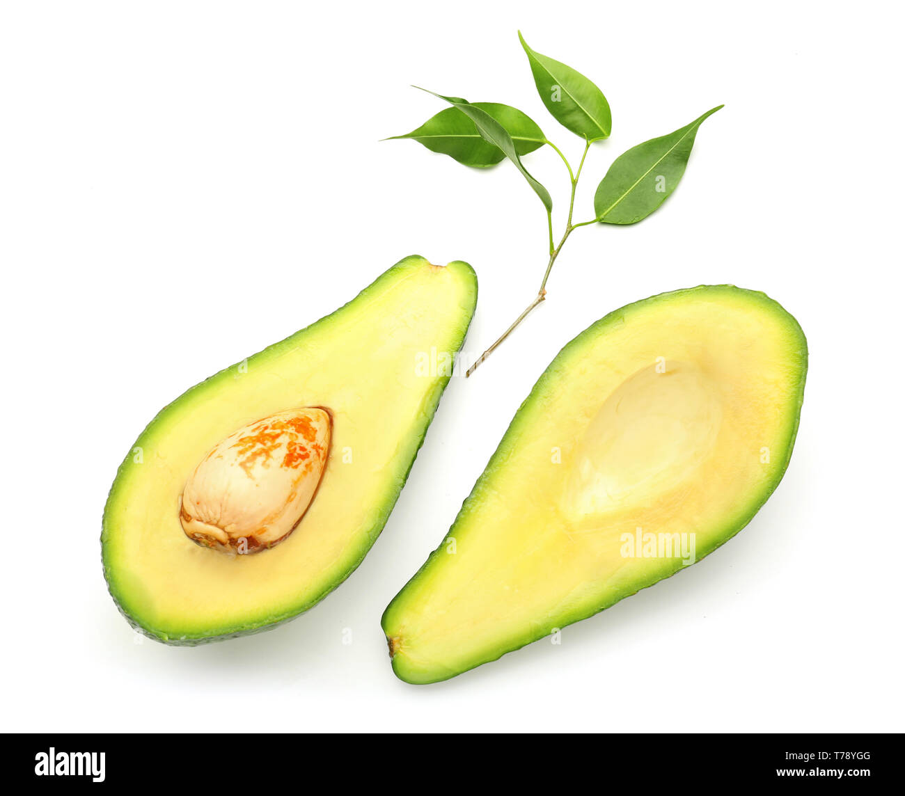 Halves of ripe avocado on white background Stock Photo - Alamy