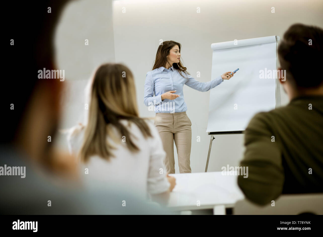 Creative positive female leader talking about business plan with ...