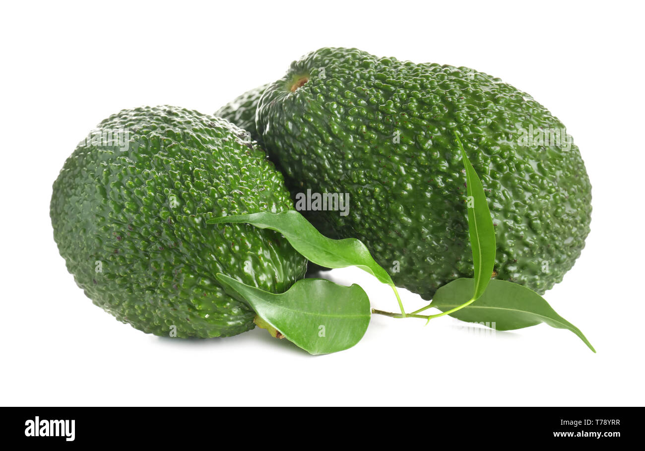 Ripe avocados on white background Stock Photo - Alamy