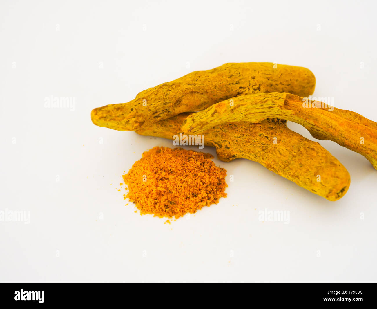 yellow curcuma roots and ground heap of curcuma isolated Stock Photo ...