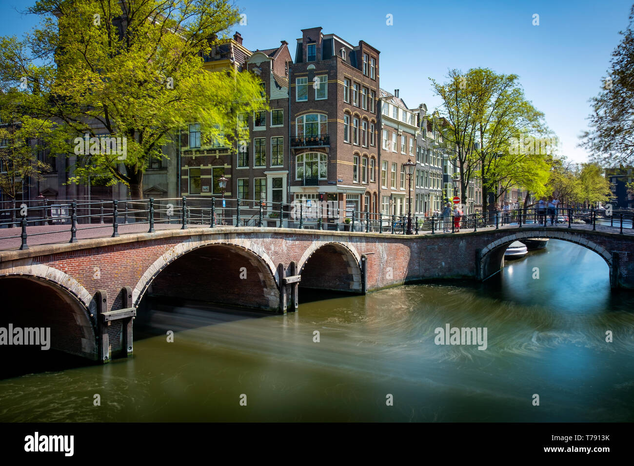 Four famous bridges over the Keizersgracht canal and the Prinsengracht ...