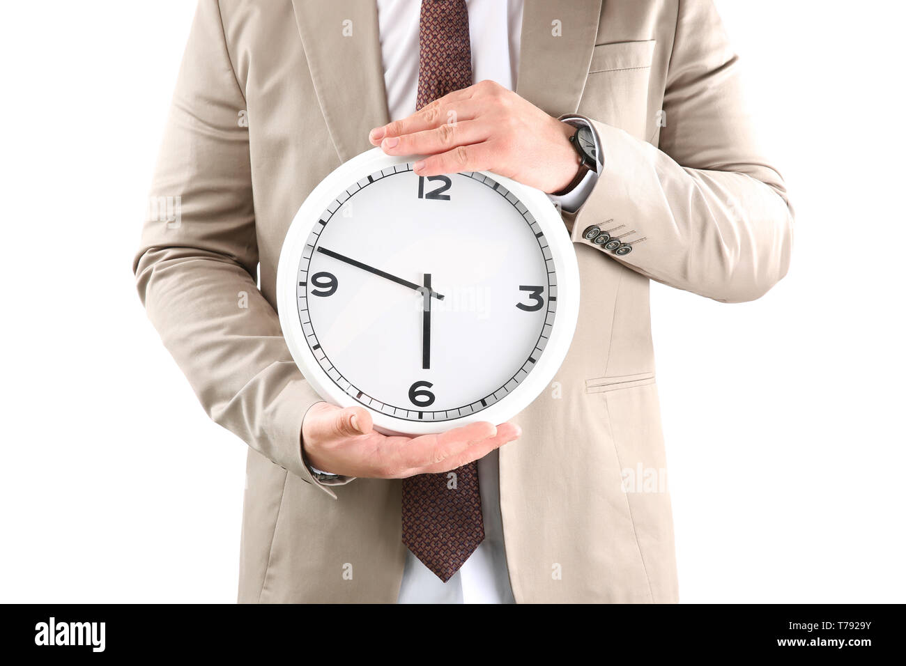 Man holding clock on white background. Time management concept Stock ...