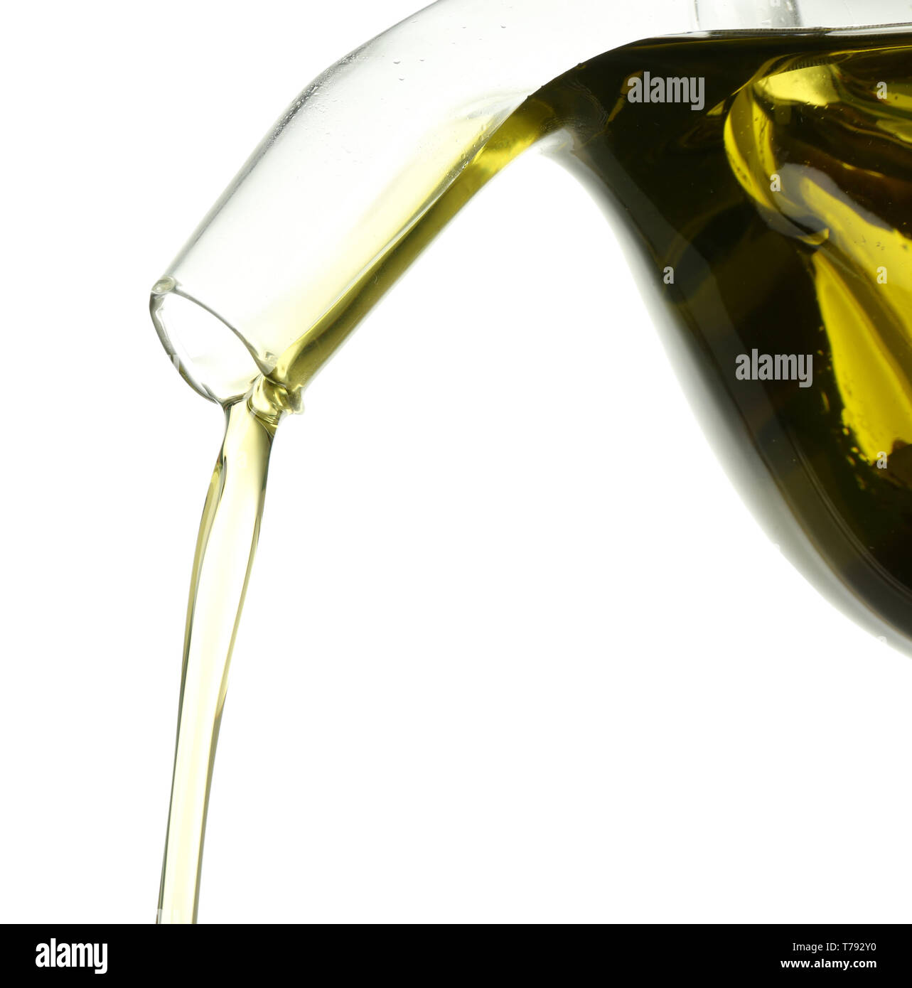 Pouring fresh olive oil on white background Stock Photo - Alamy