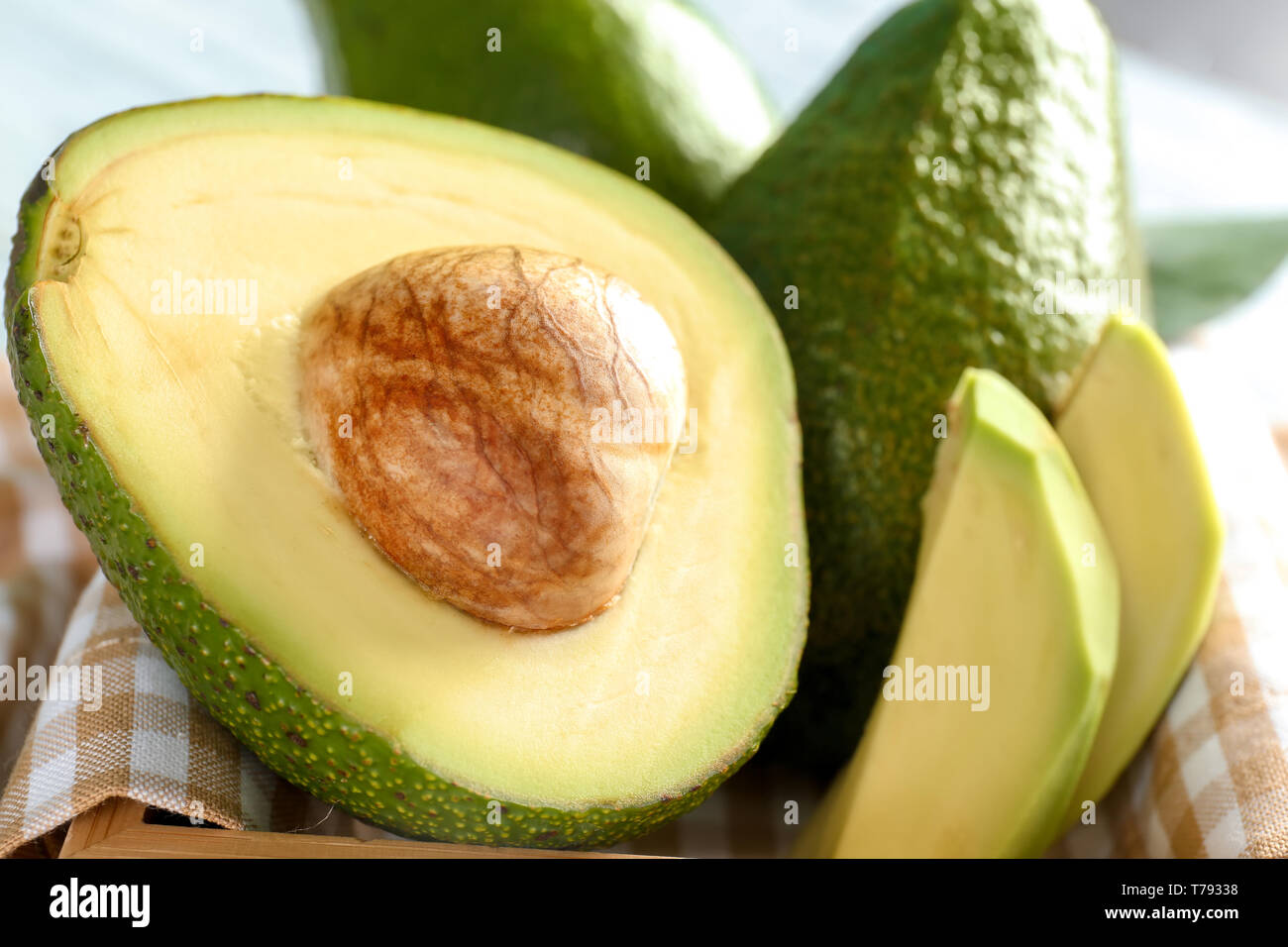Fresh cut avocado on table, closeup Stock Photo - Alamy