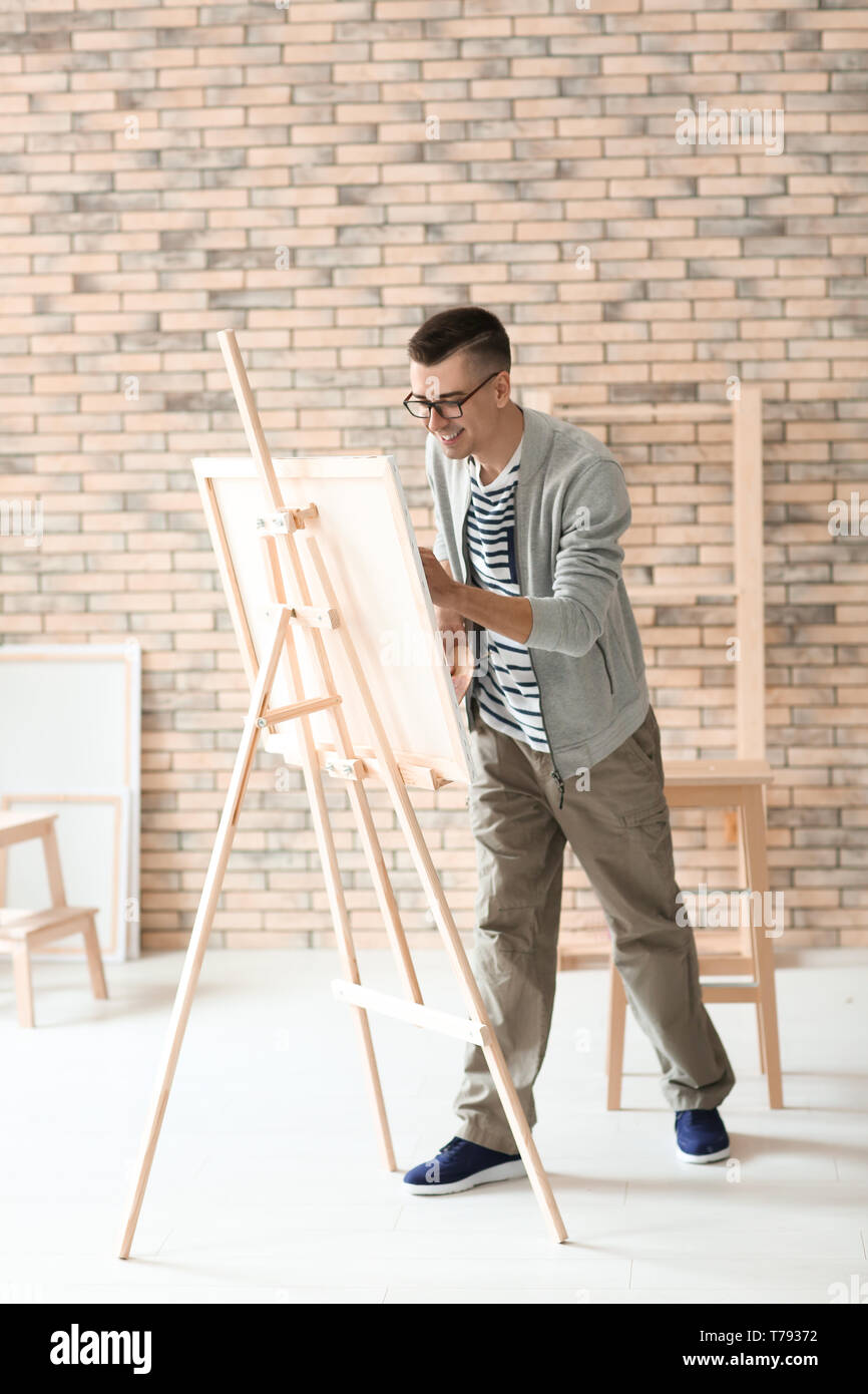 Male artist painting on canvas hi-res stock photography and images - Alamy