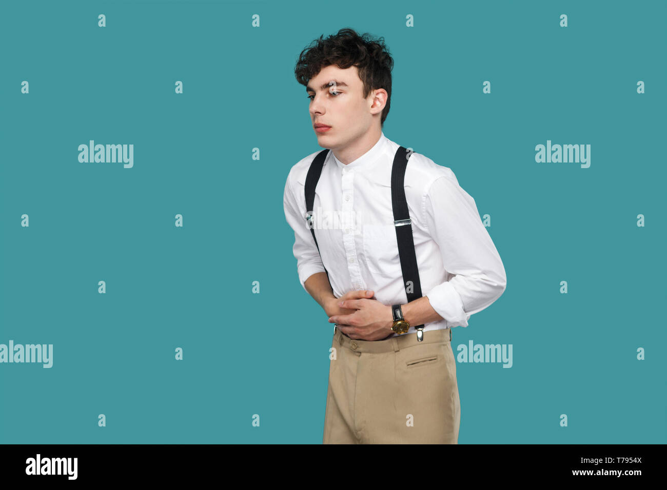 Stomach pain. man feeling bad and holding his painful belly. Portrait ...