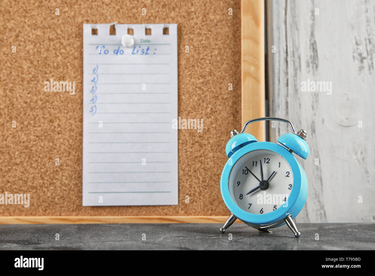 Alarm clock on table. Time management concept Stock Photo - Alamy