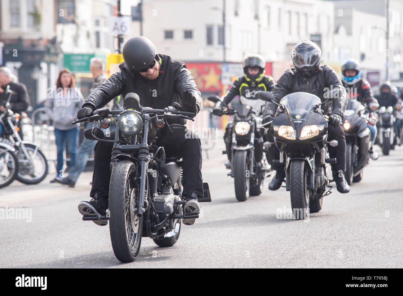 Group arriving led by Harley Davidson motorbike ridden at the Southend ...