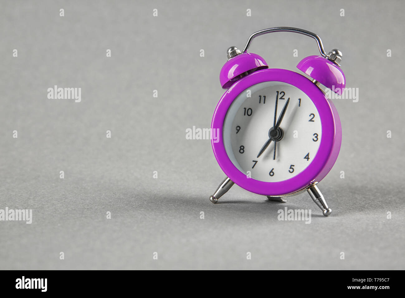 Alarm clock on grey background. Time management concept Stock Photo - Alamy