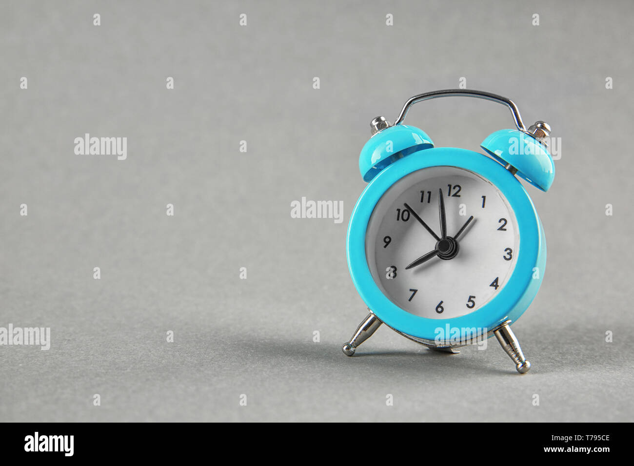 Alarm clock on grey background. Time management concept Stock Photo - Alamy