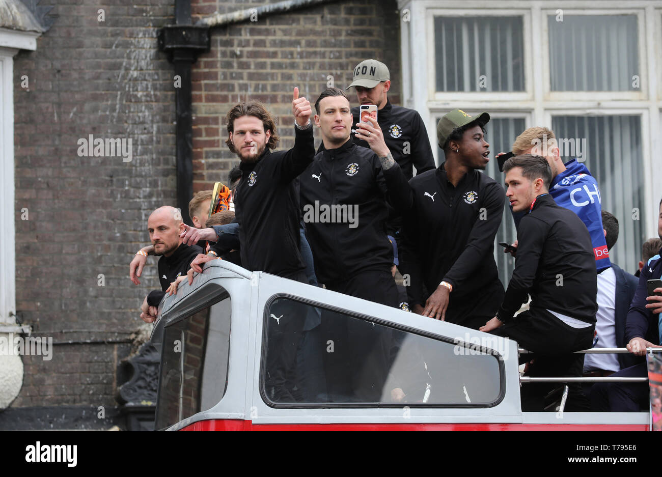 Luton Town players celebrate during the victory parade at St George's ...
