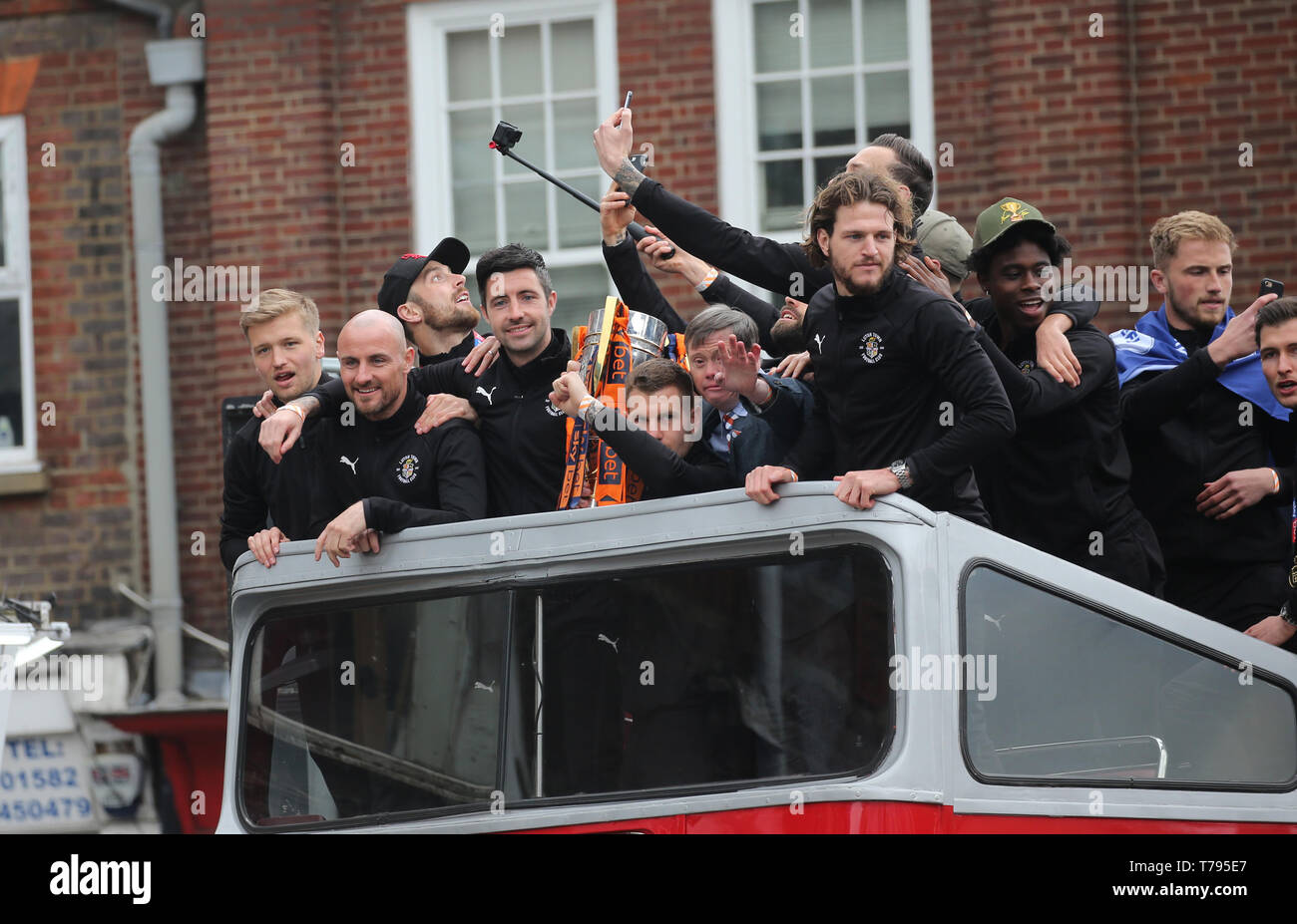Luton Town players celebrate during the victory parade at St George's ...