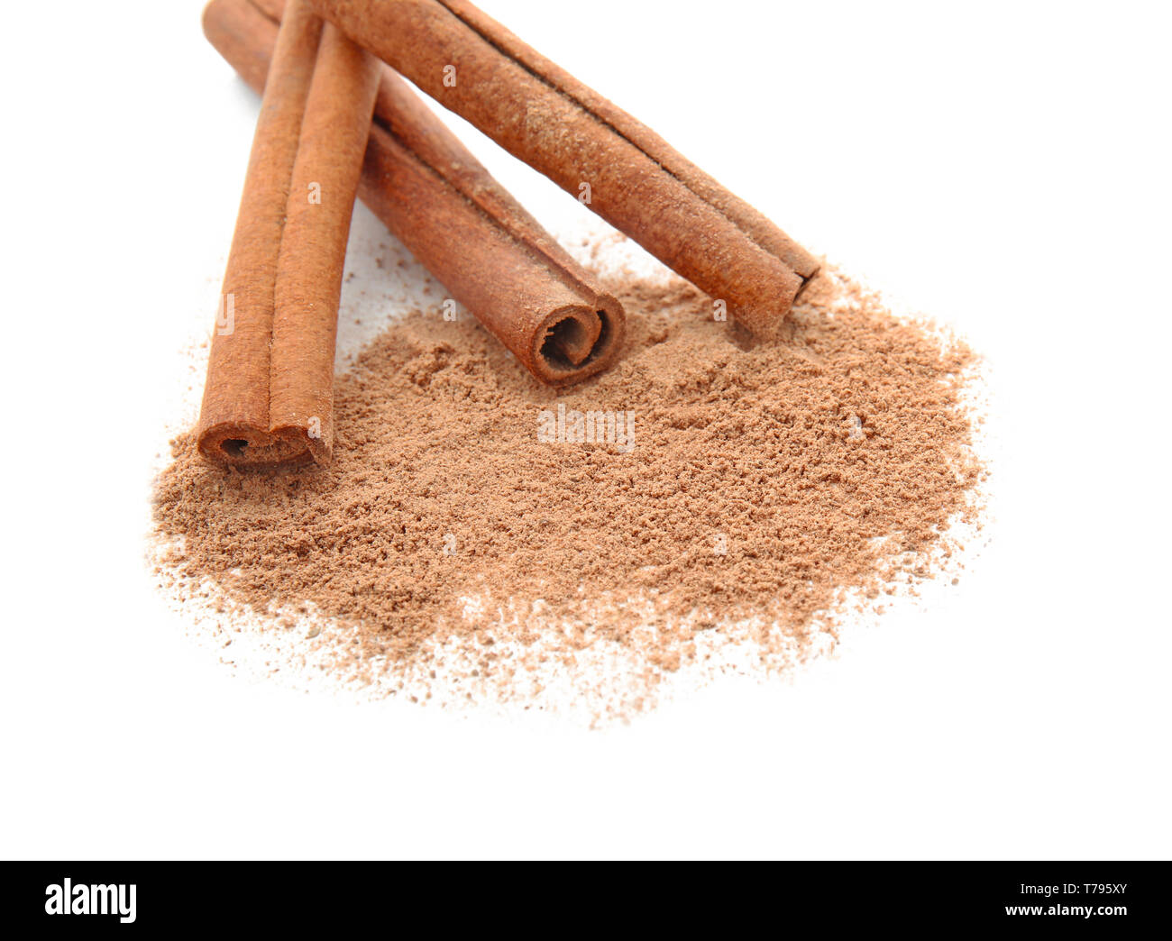 Cinnamon sticks and powder on white background Stock Photo - Alamy