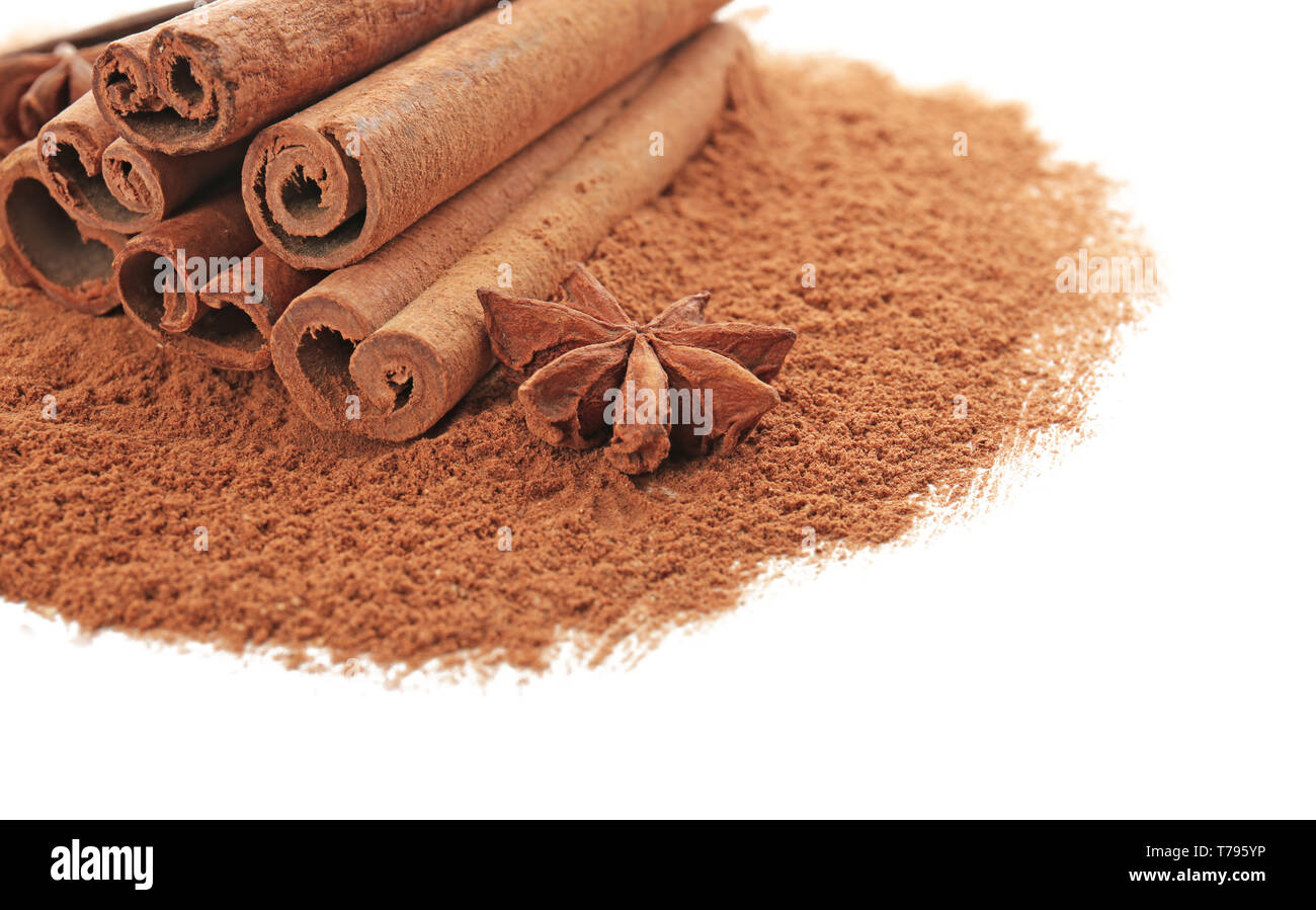 Cinnamon sticks and powder on white background Stock Photo - Alamy