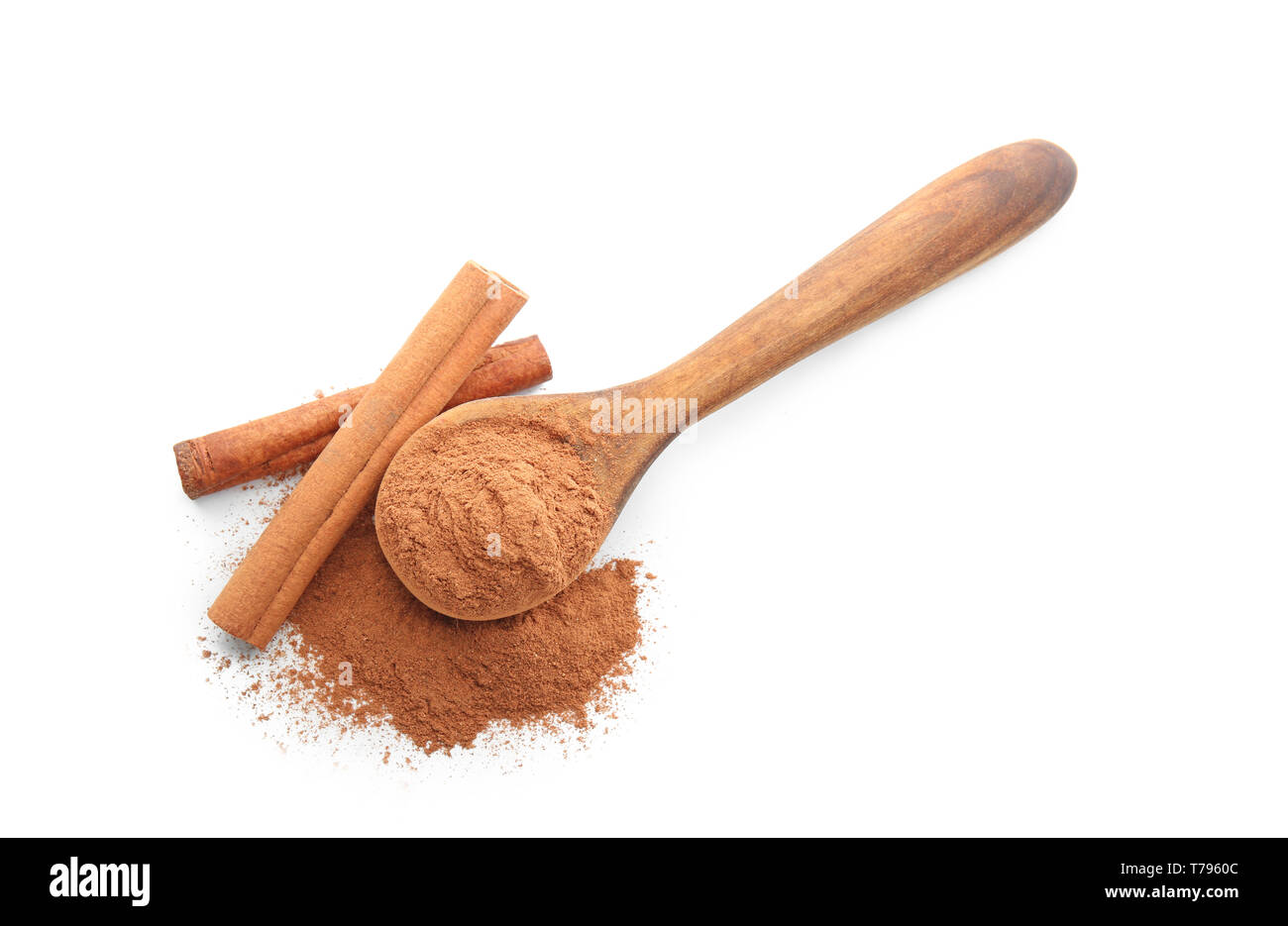 Spoon with cinnamon powder and sticks on white background Stock Photo ...