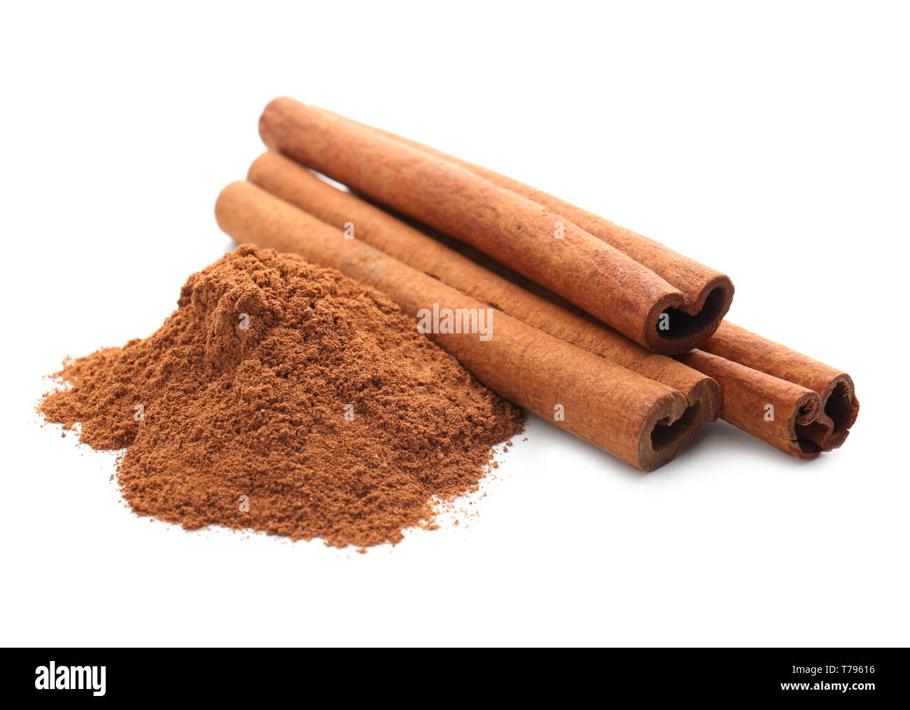 Cinnamon sticks and powder on white background Stock Photo - Alamy