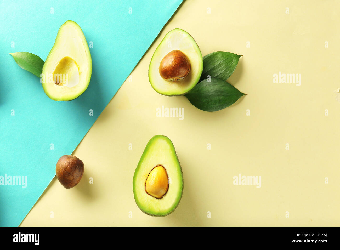 Flat lay composition with ripe avocados on color background Stock Photo ...