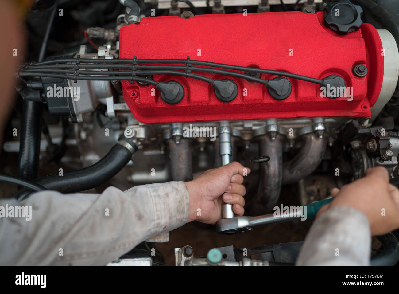 Technician engine checking car service Stock Photo - Alamy