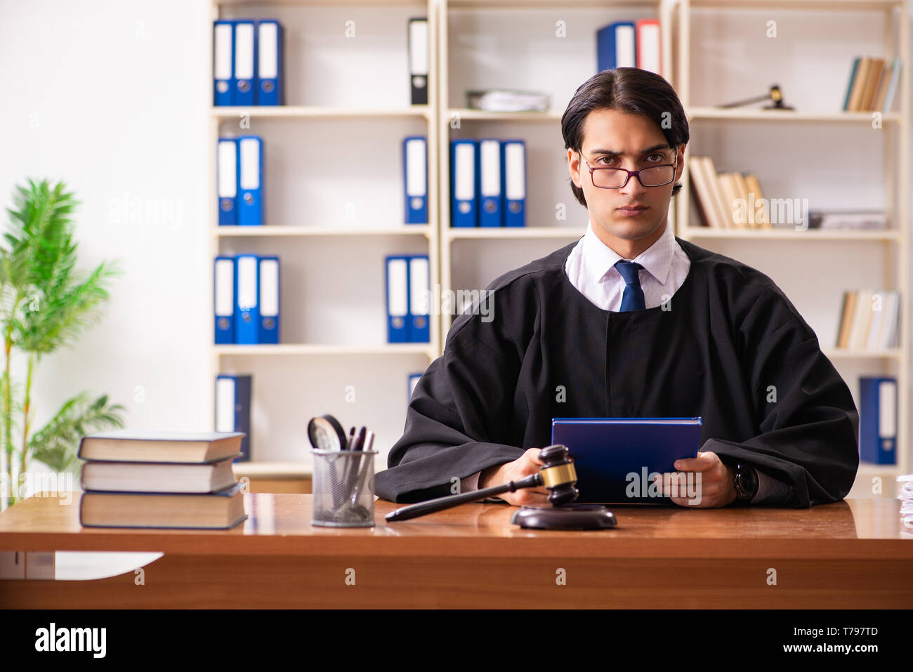 Young handsome judge working in court Stock Photo - Alamy