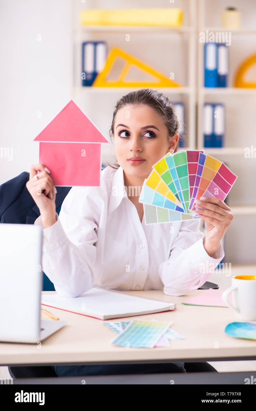 Female beautiful designer working in the office Stock Photo - Alamy
