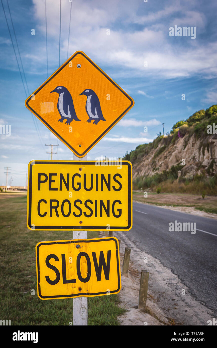 Slow penguins crossing road sign hi-res stock photography and images ...