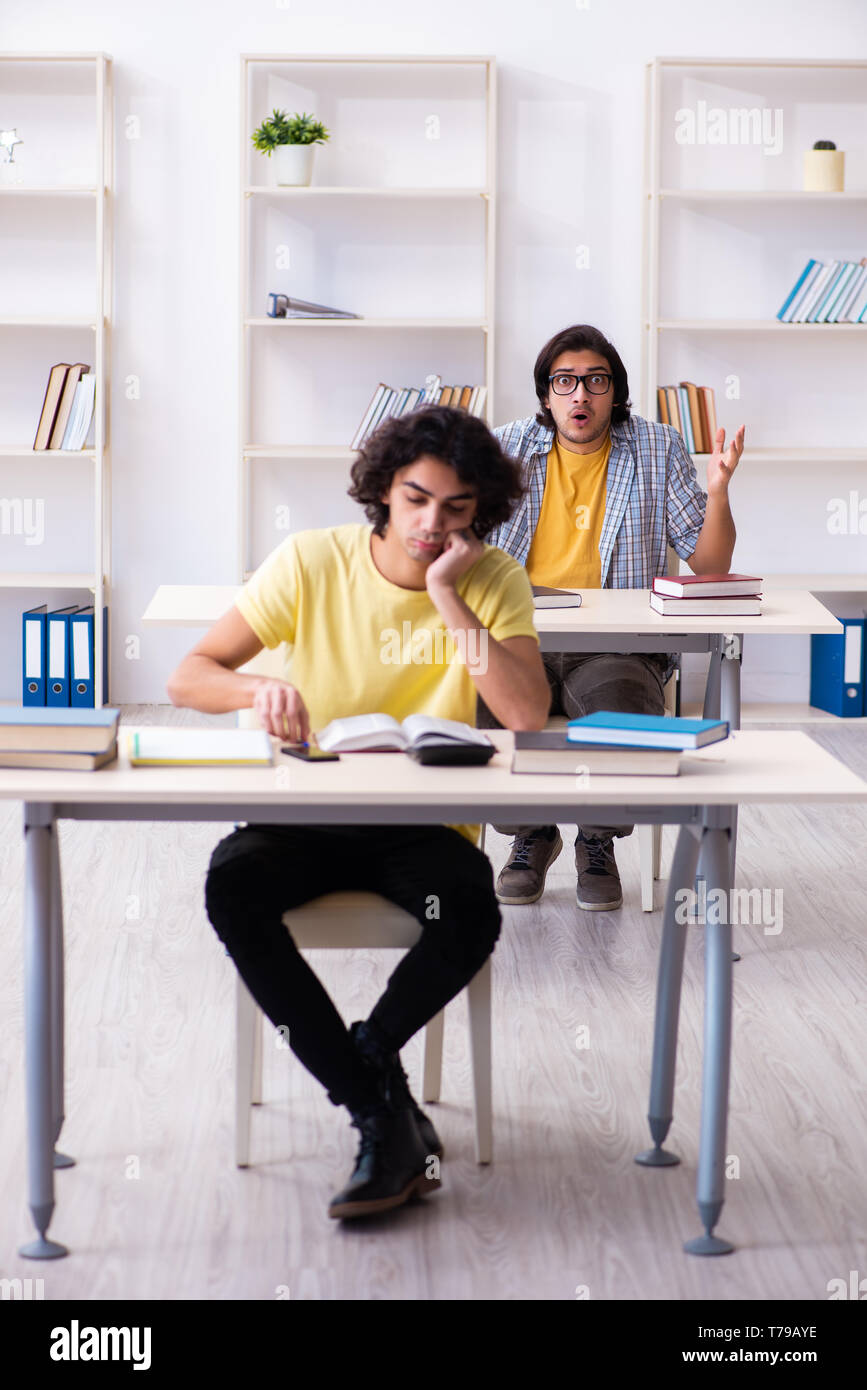 Two male students in the classroom Stock Photo - Alamy