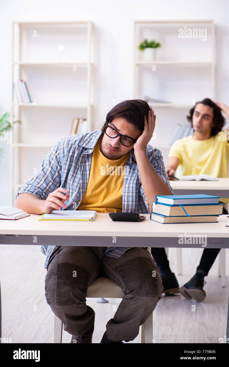 Two male students in the classroom Stock Photo - Alamy