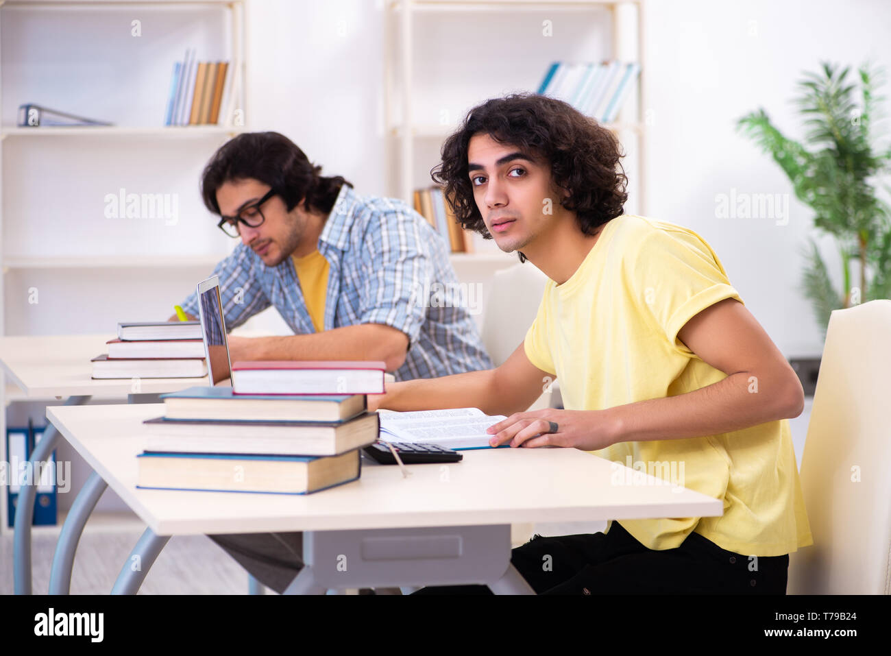 Two male students in the classroom Stock Photo - Alamy