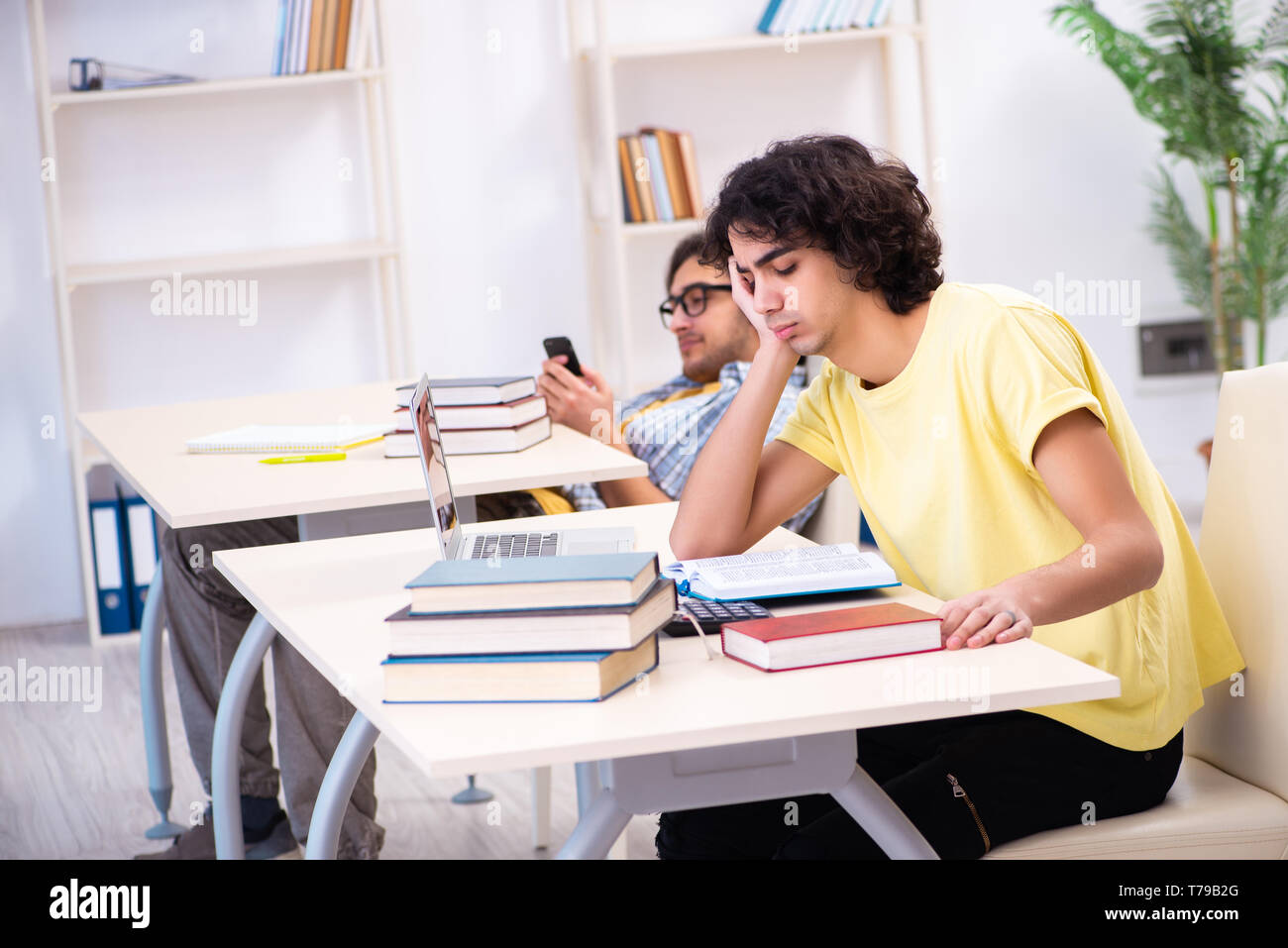 Two male students in the classroom Stock Photo - Alamy