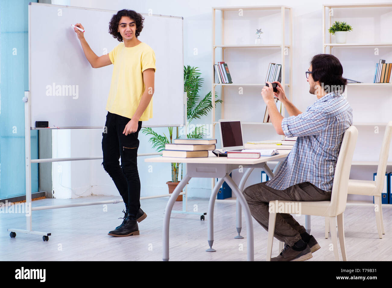 Two male students in the classroom Stock Photo - Alamy