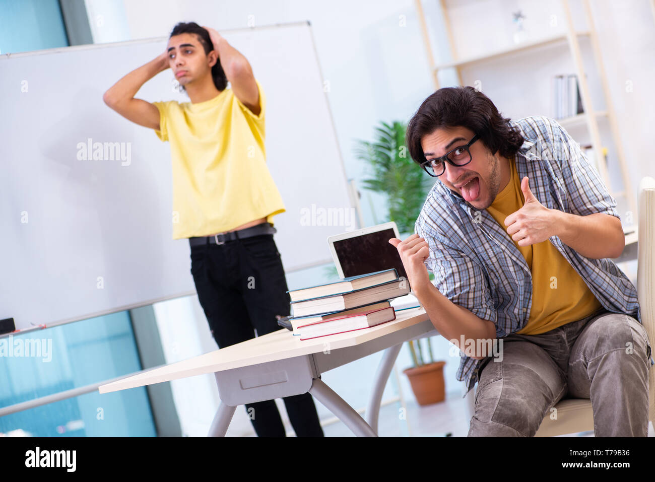Two male students in the classroom Stock Photo - Alamy