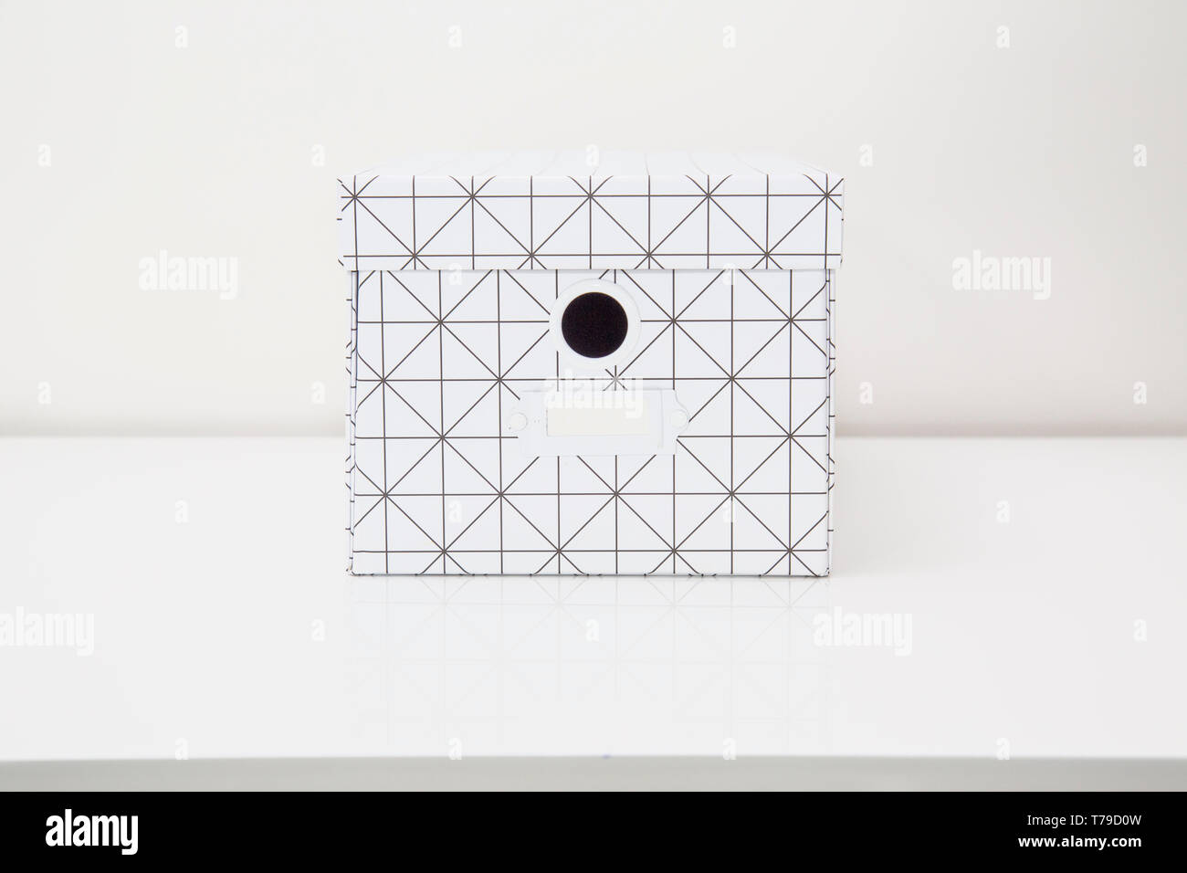 Single storage box with lid, black and white geometric shape. Sitting ...