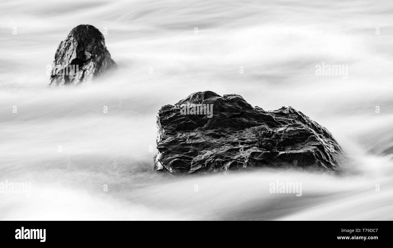 Rocks in water Stock Photo - Alamy