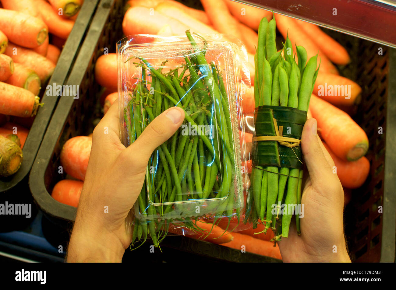 Beans bundled in a plastic package and other beans wrapped in Banana ...