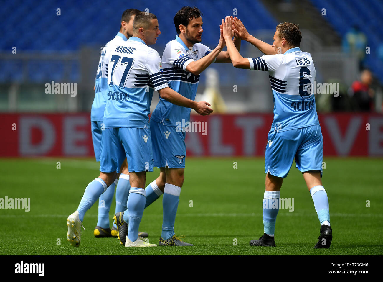 Marco Parolo of Lazio celebrates wit team mates Lucas Leiva and Adam ...